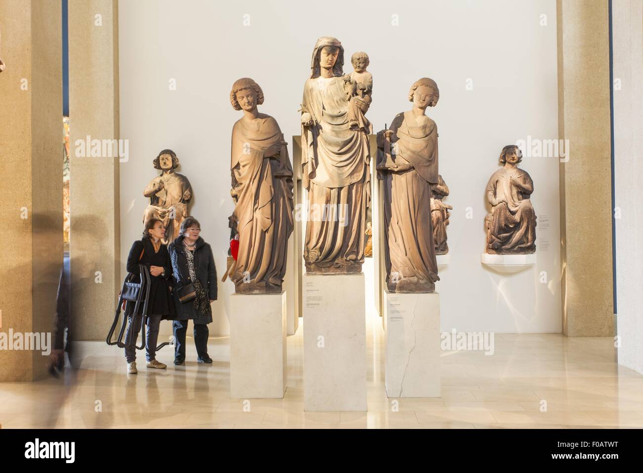 Children looking at sculptures of prophets in Munster at sculpture hall ...