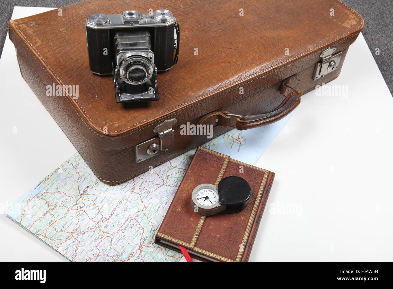Diary, camera, briefcase and map for travel on white background Stock ...