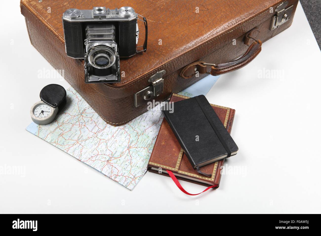 Diary, camera, briefcase and map for travel on white background Stock ...