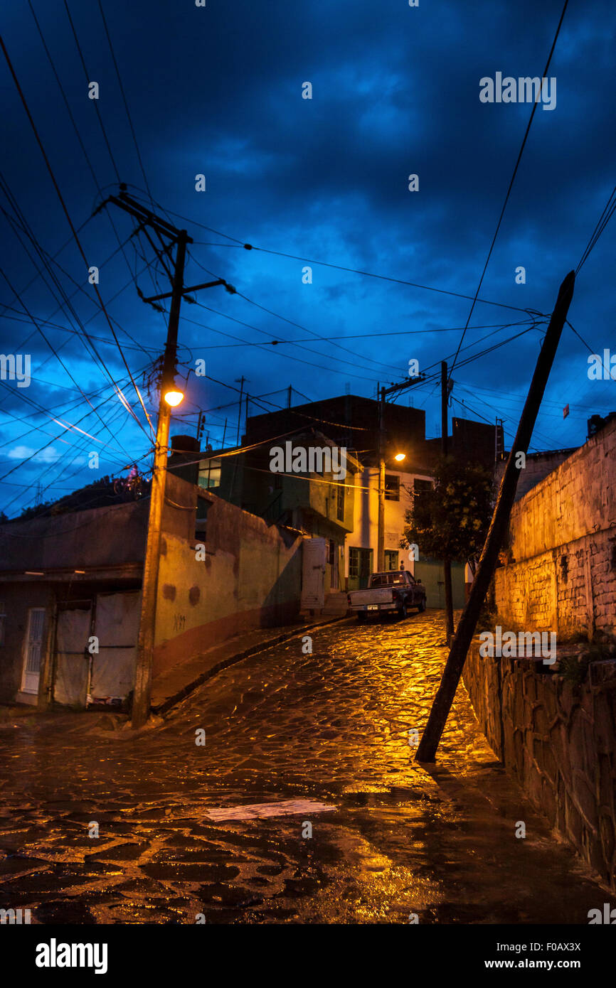 Suggestive lighting of a alley under a blue sky in twilight hours ...