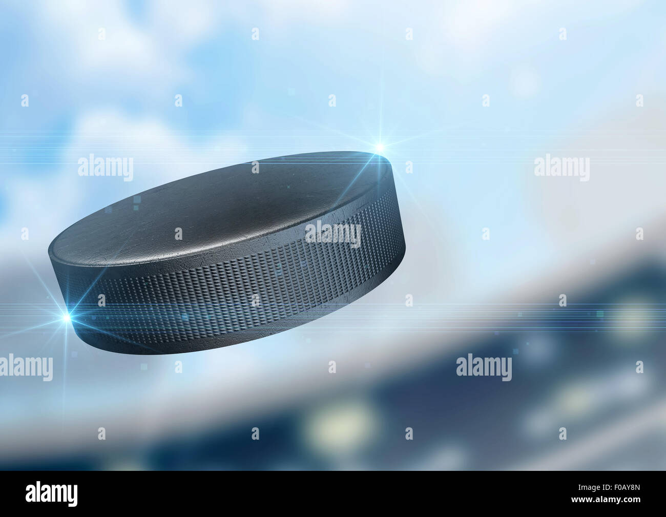 A regular ice hockey puck flying through the air on a stadium ...
