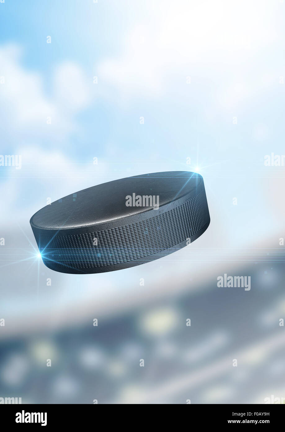 A regular ice hockey puck flying through the air on a stadium ...