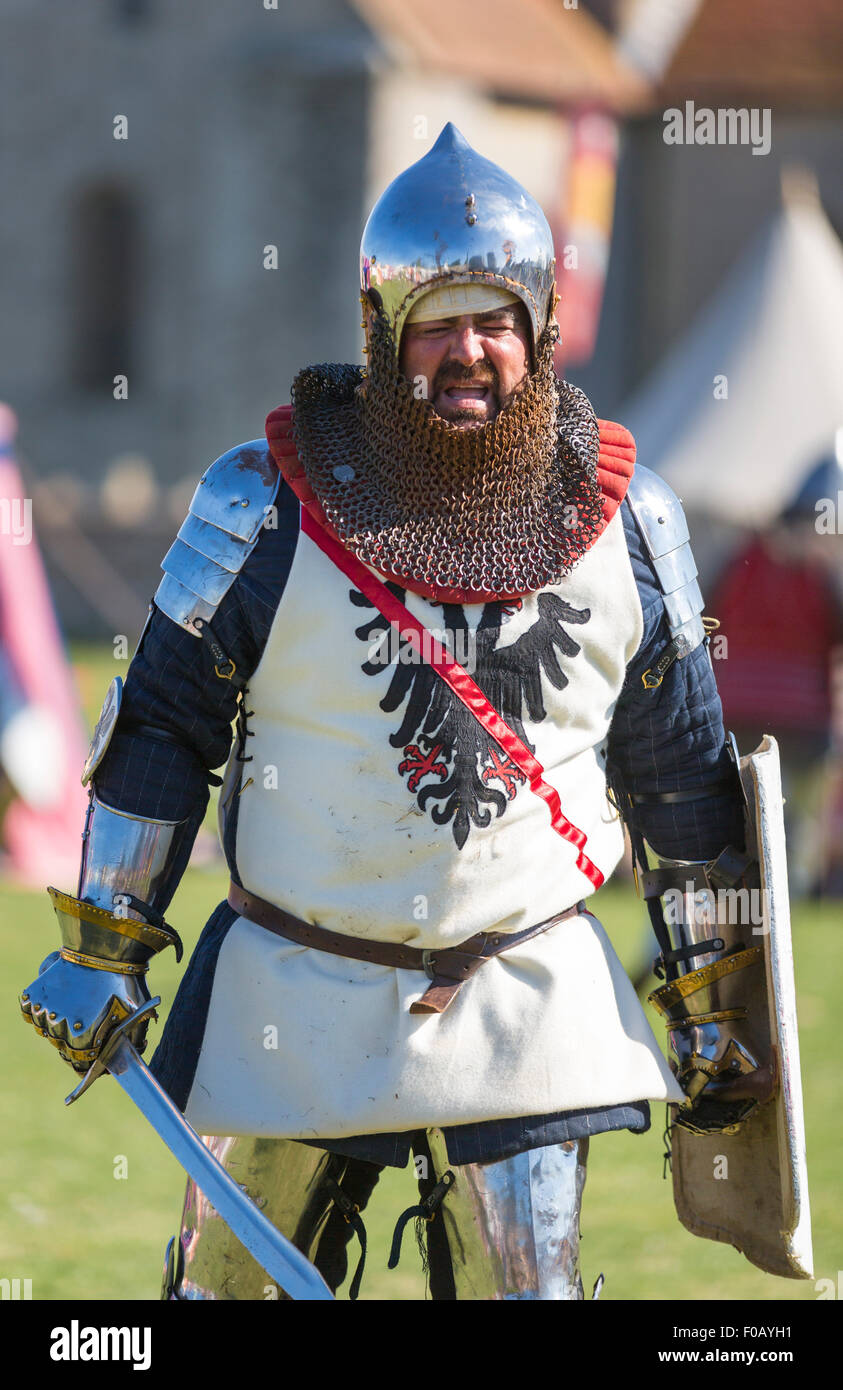 Performers in heavy armour fight at Portchester Castle in Hampshire ...