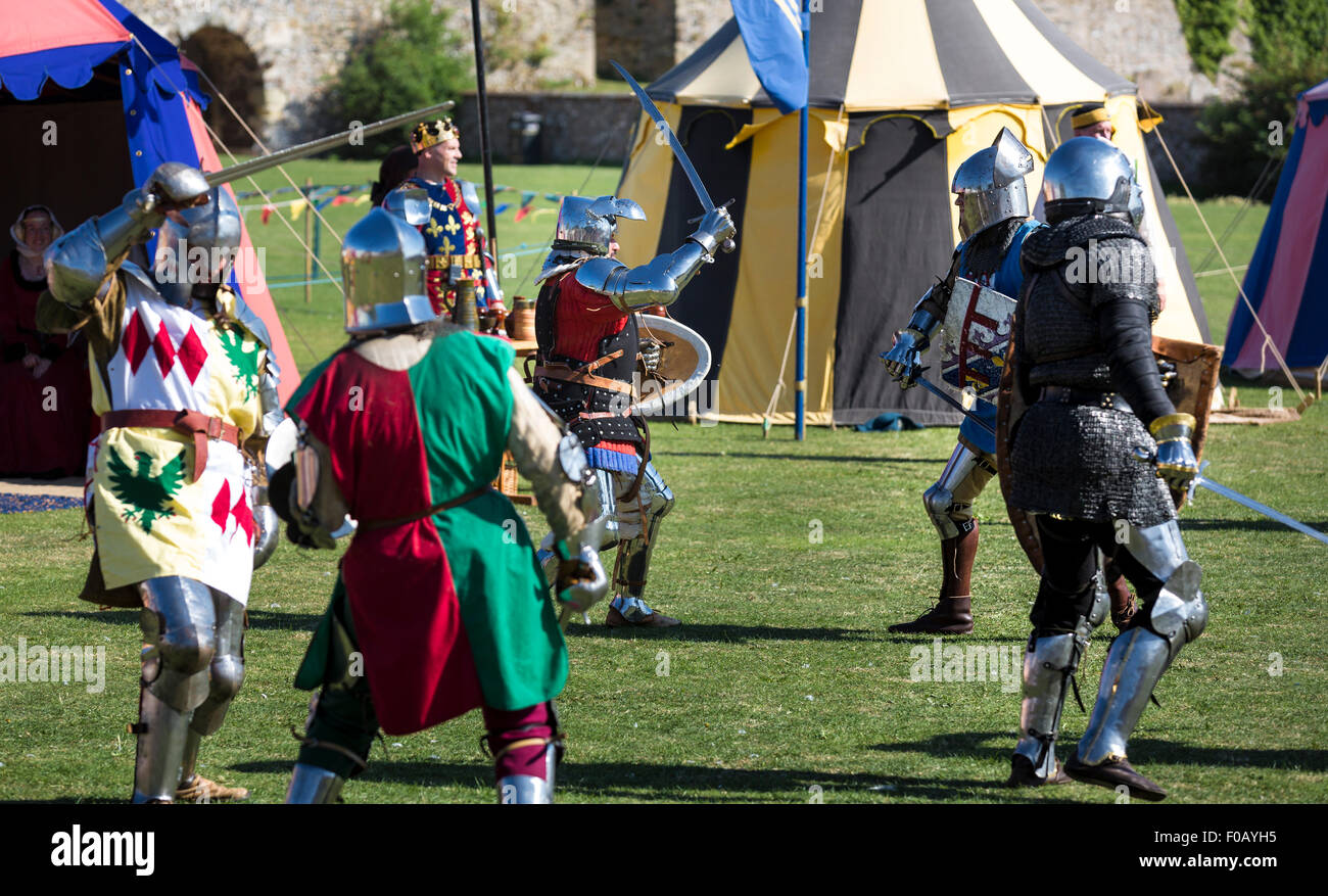 Performers in heavy armour fight at Portchester Castle in Hampshire ...