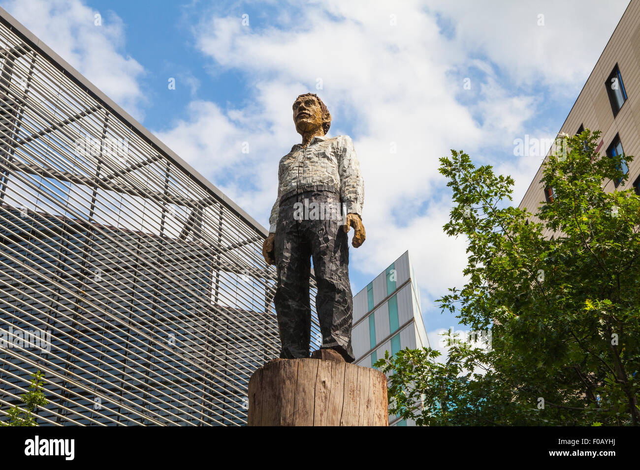 LONDON, UK - AUGUST 7TH 2015: A wooden sculpture of a standing man in ...