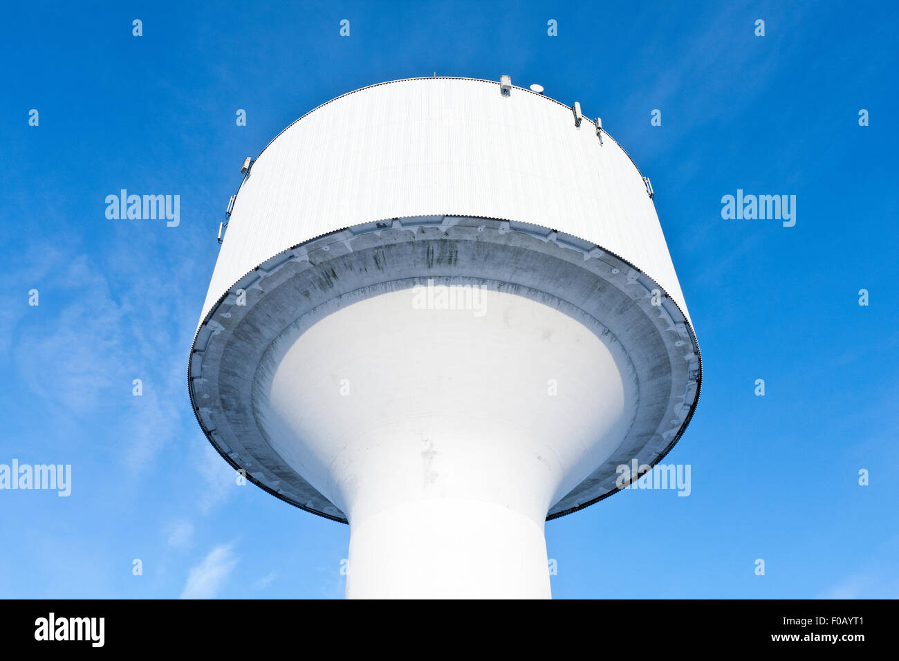 Huge water tower, container in concrete. Sunny blue sky in the ...