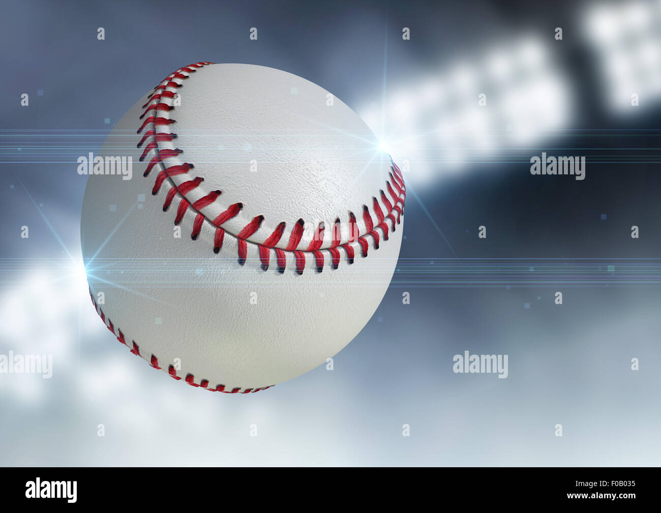 A regular baseball ball flying through the air on an indoor stadium ...