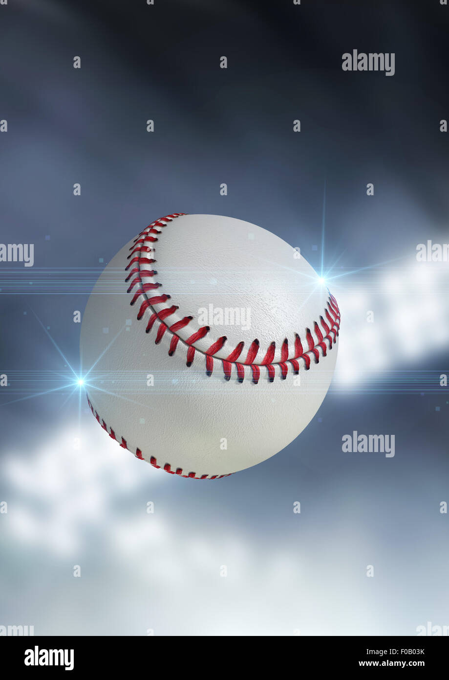 A regular baseball ball flying through the air on an indoor stadium ...