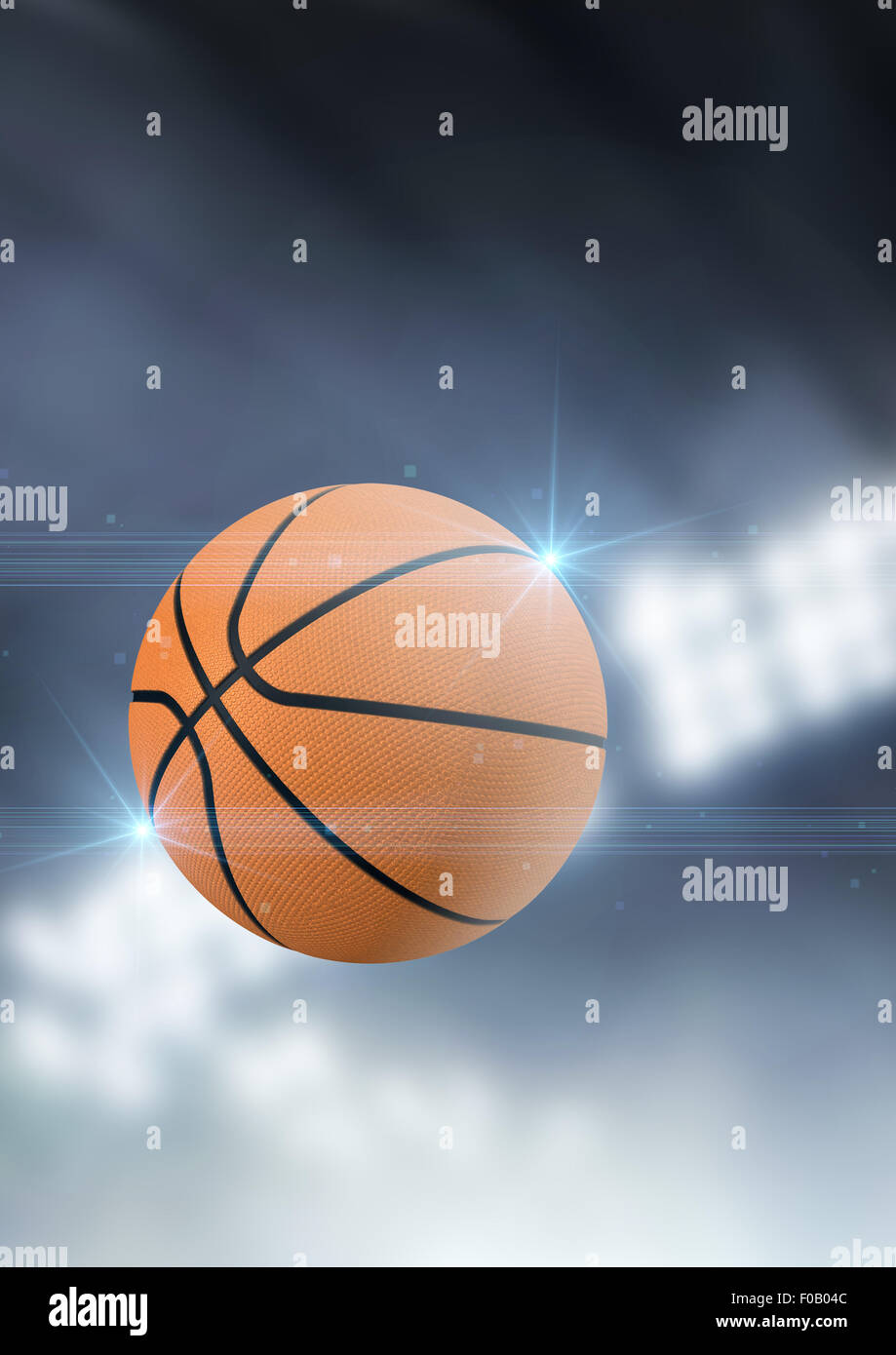 A regular basketball flying through the air on an indoor stadium ...