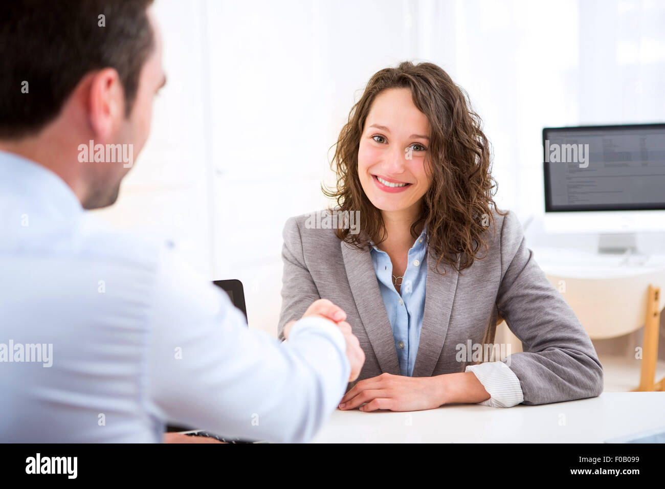 View of a Young attractive woman during job interview Stock Photo - Alamy