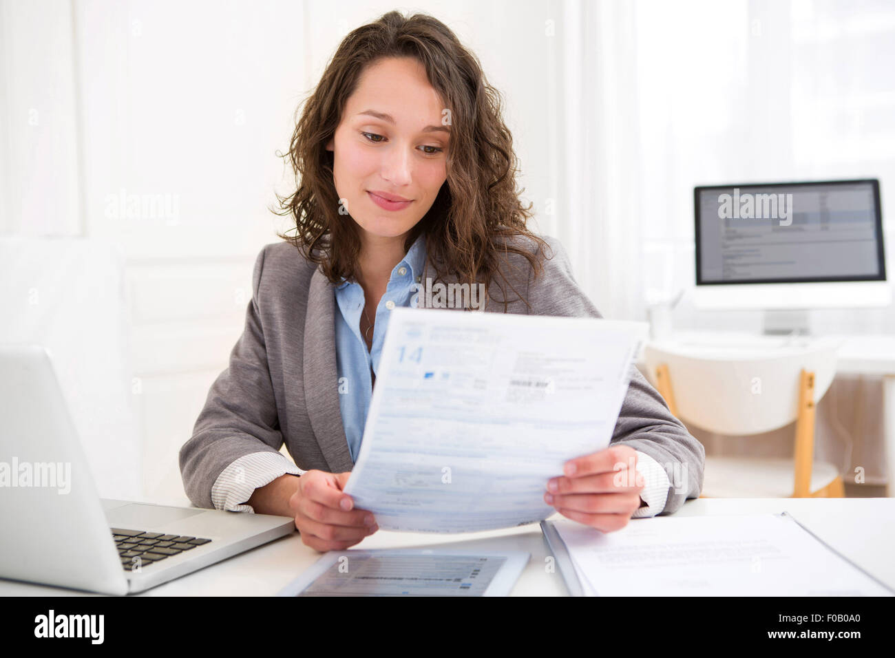 Woman doing paperwork hi-res stock photography and images - Alamy