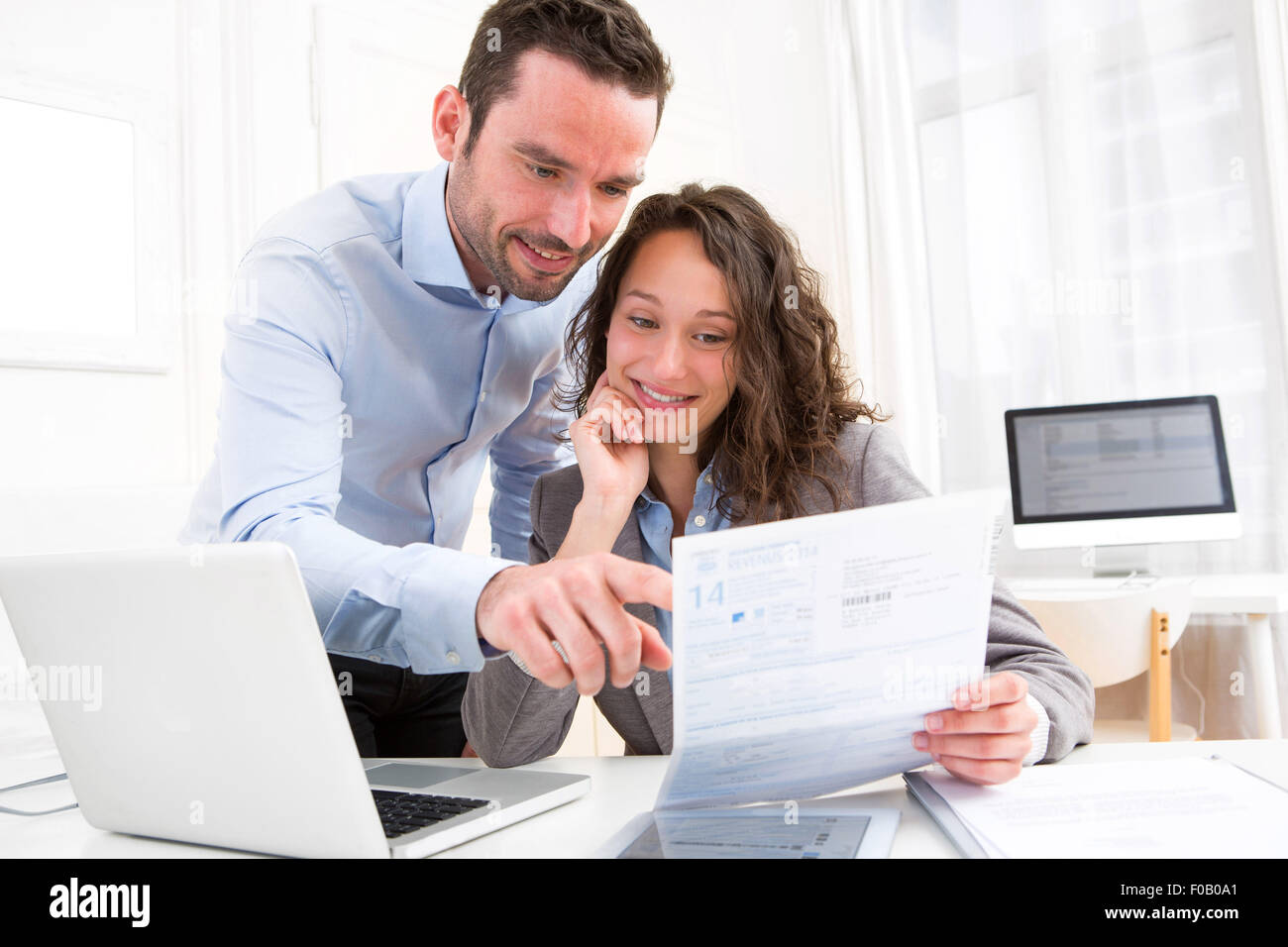 Young couple doing paperwork hi-res stock photography and images - Alamy