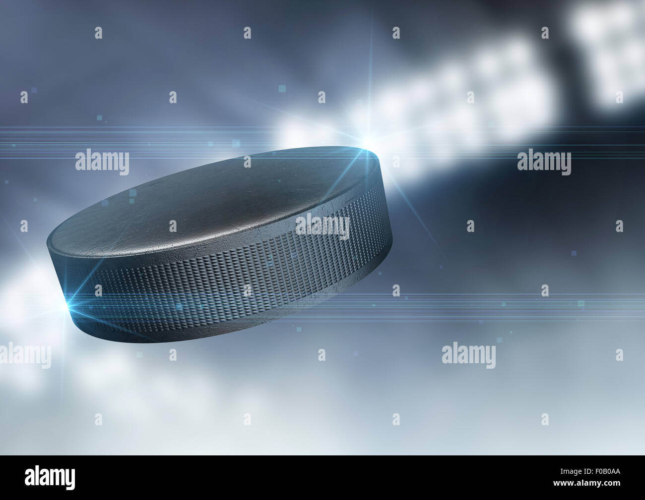 A regular ice hockey puck flying through the air on an indoor stadium ...