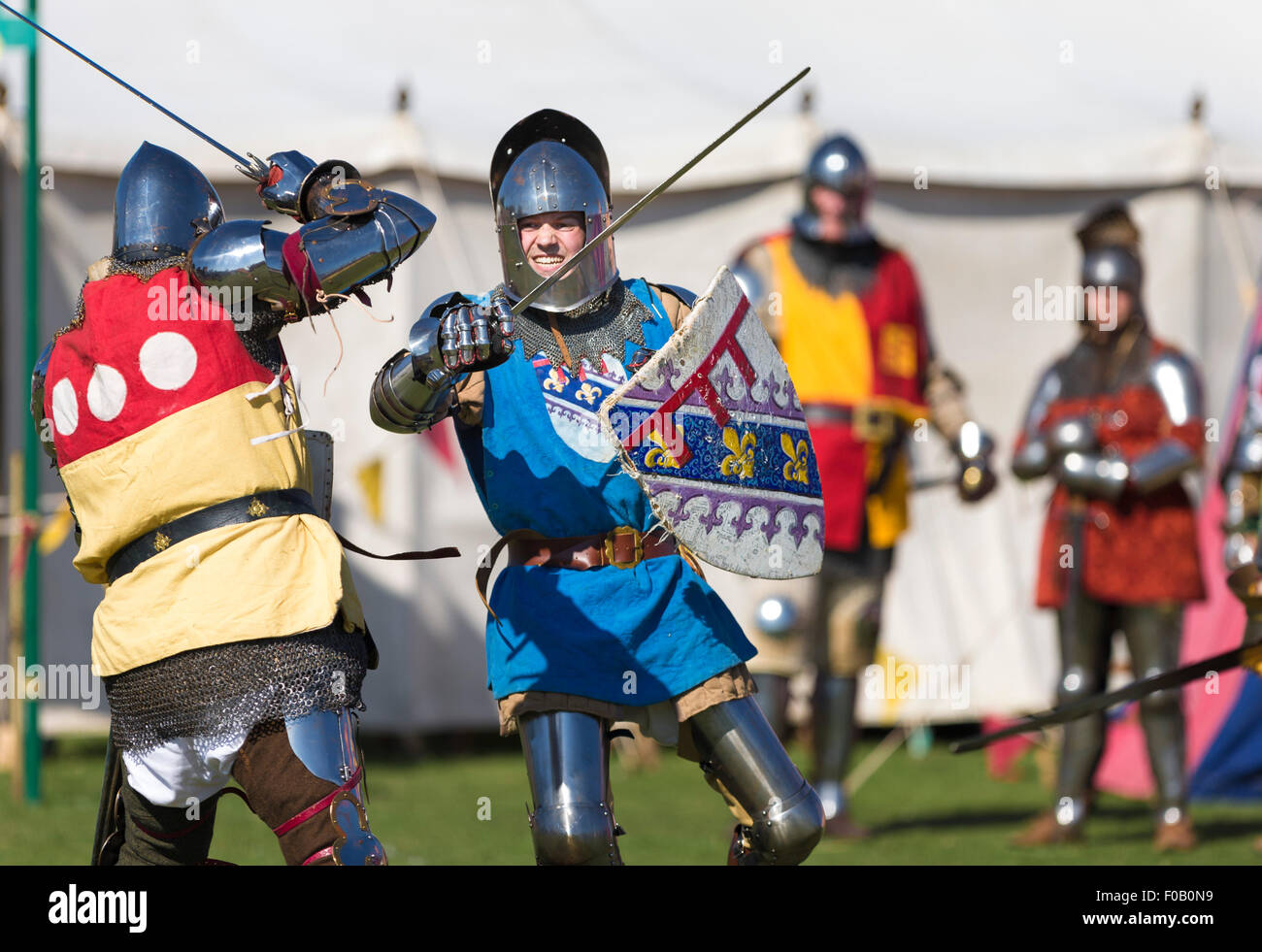 Performers in heavy armour fight at Portchester Castle in Hampshire ...