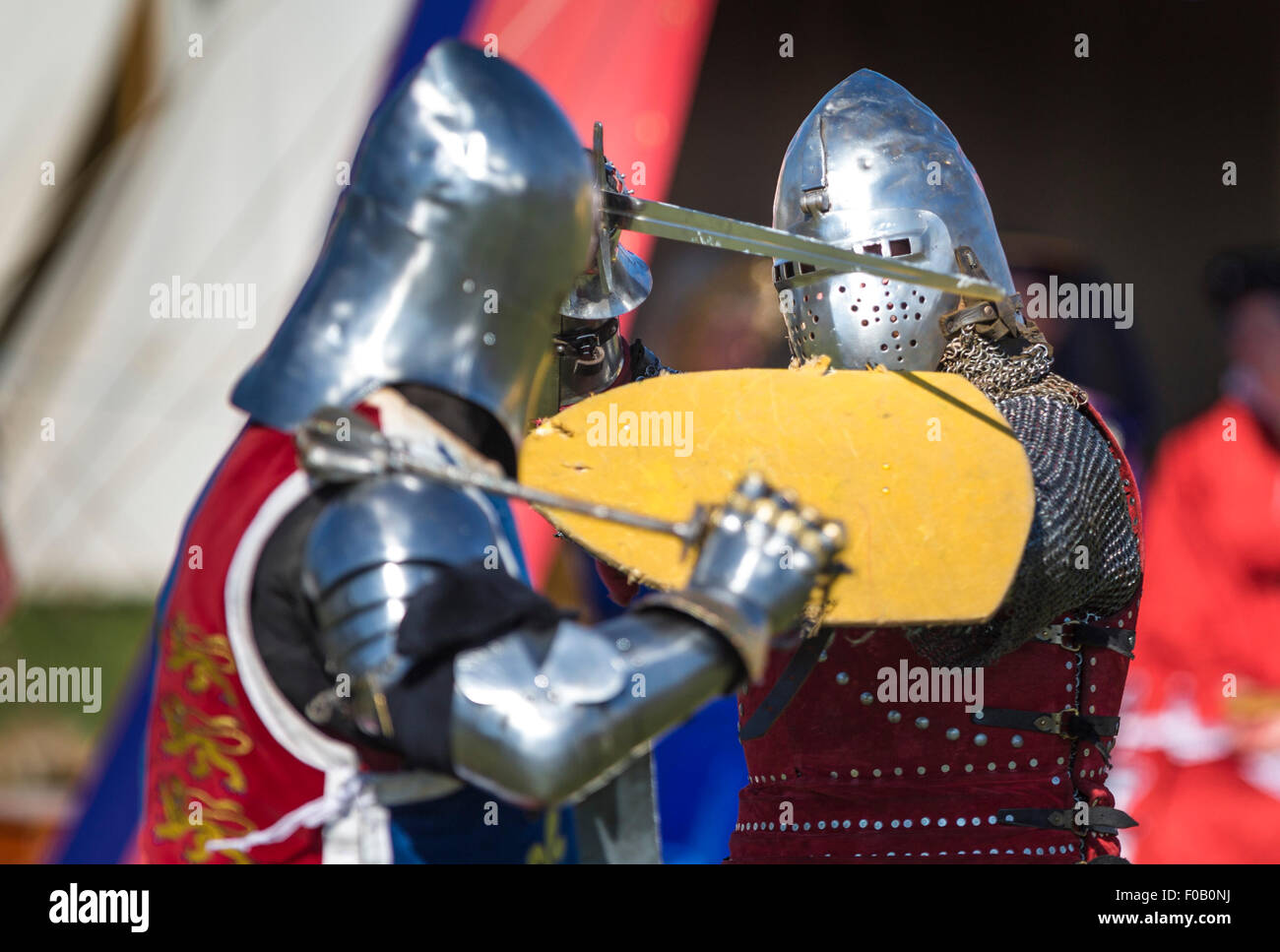 Performers in heavy armour fight at Portchester Castle in Hampshire ...