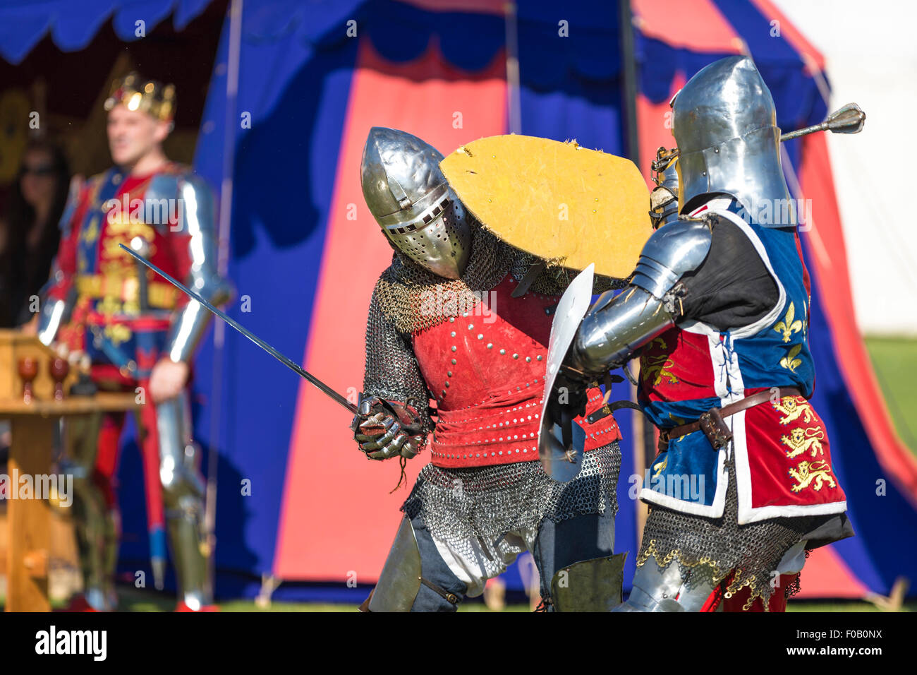 Performers in heavy armour fight at Portchester Castle in Hampshire ...