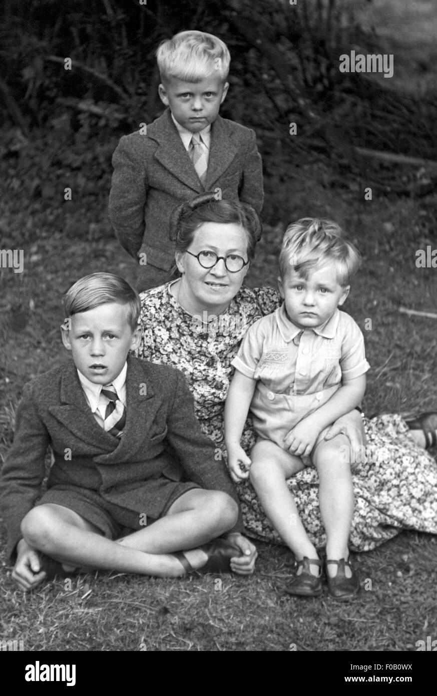 Portrait of a mother with her three sons Stock Photo - Alamy