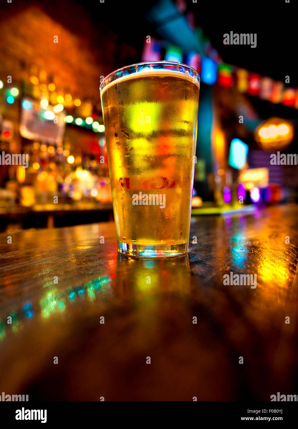 Pint of beer on a bar in a traditional style pub Stock Photo - Alamy