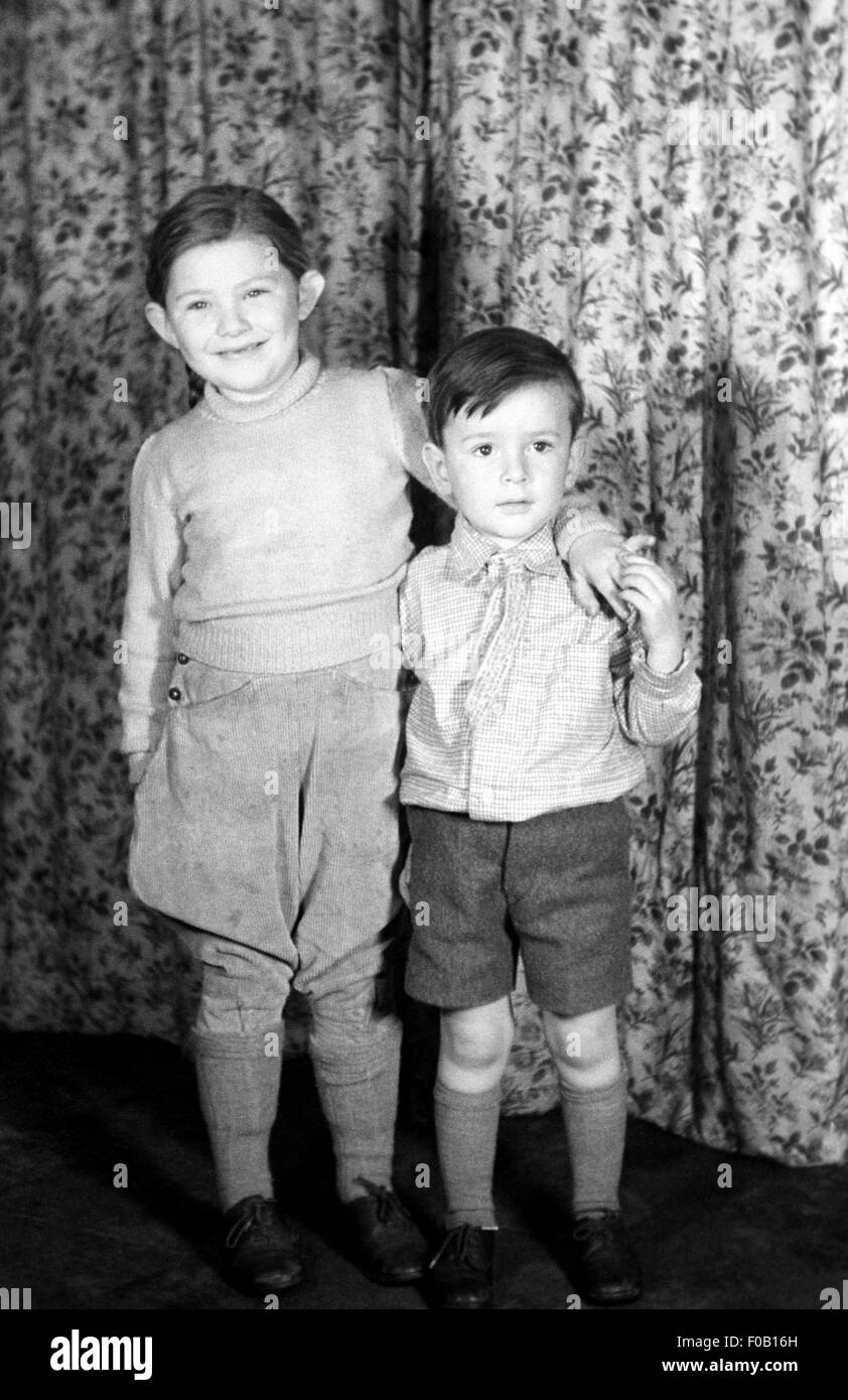 Two brothers hugging portrait Black and White Stock Photos & Images - Alamy