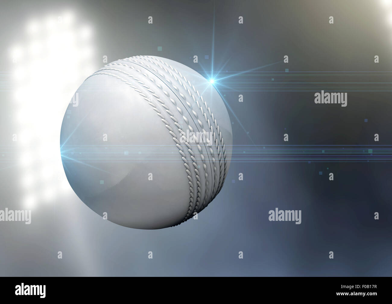 A regular white cricket ball flying through the air on an a outdoor ...