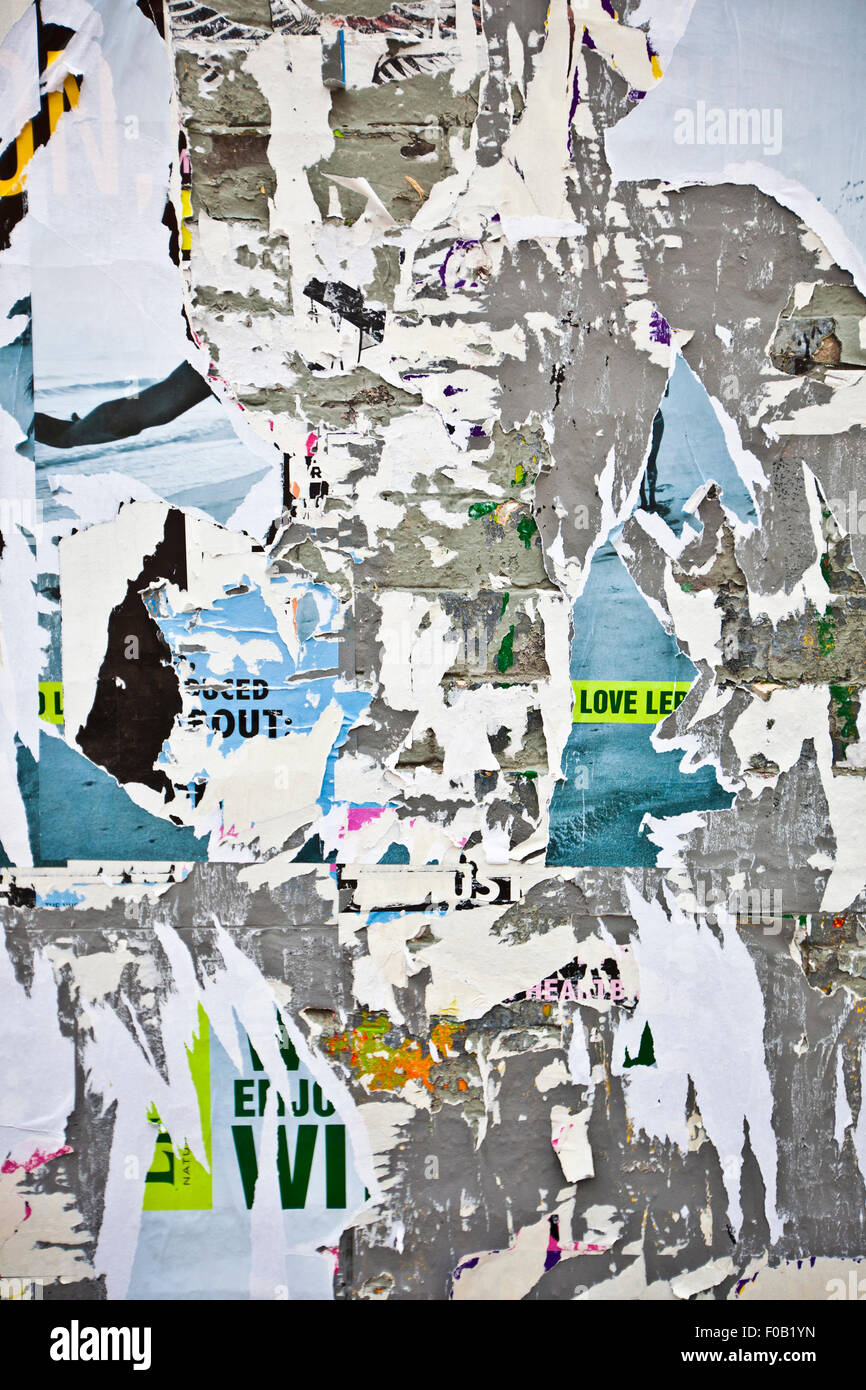 Photo of a billboard with lots of old ripped posters Stock Photo - Alamy
