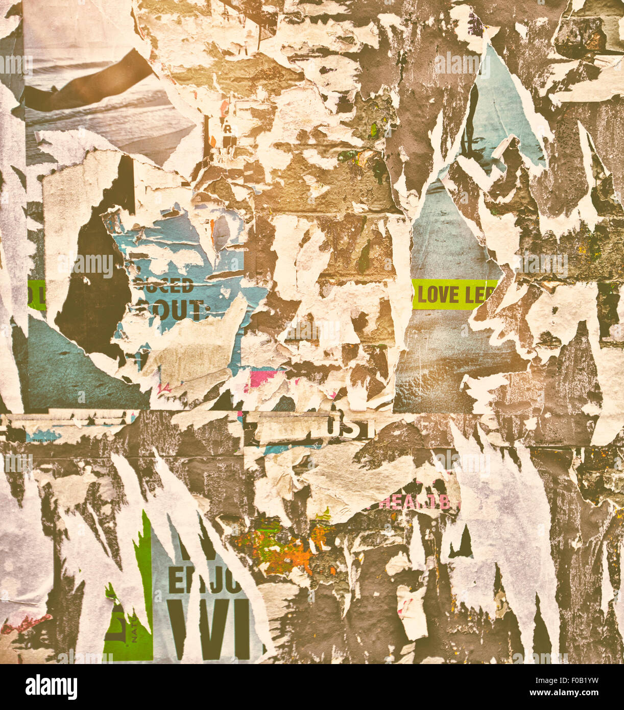 Photo of a billboard with lots of old ripped posters Stock Photo - Alamy