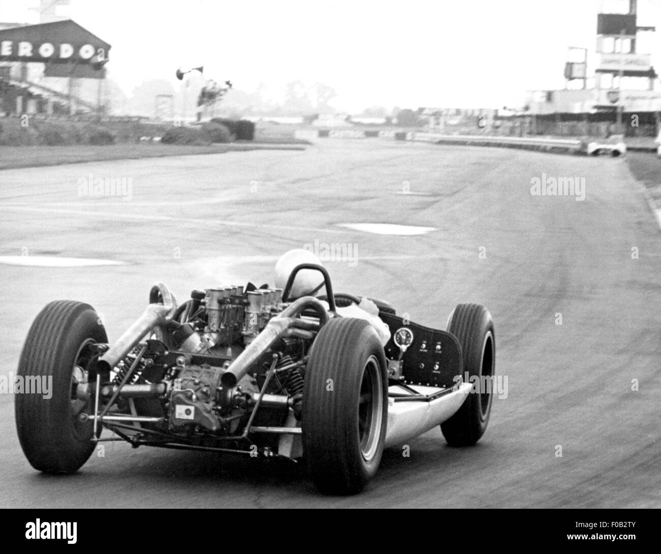 Bruce McLaren testing a sports car at Goodwood 1964 Stock Photo - Alamy
