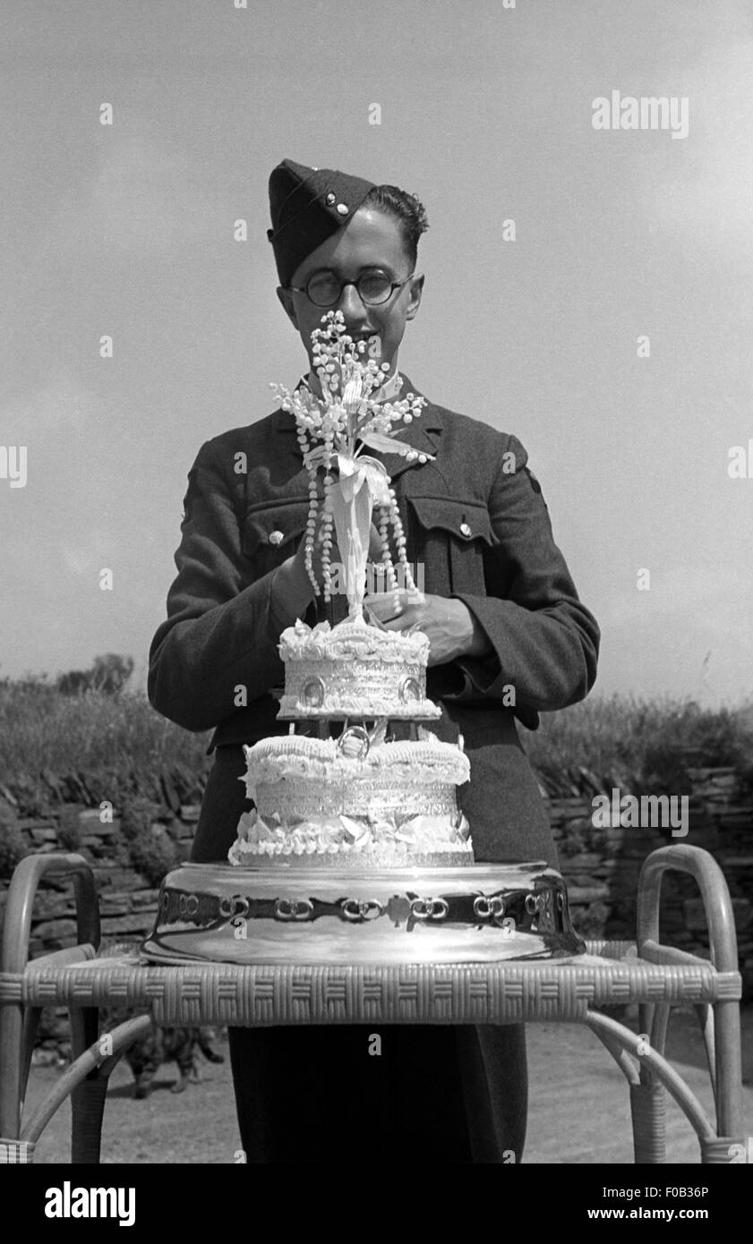 A man standing behind a celebratory cake Stock Photo - Alamy