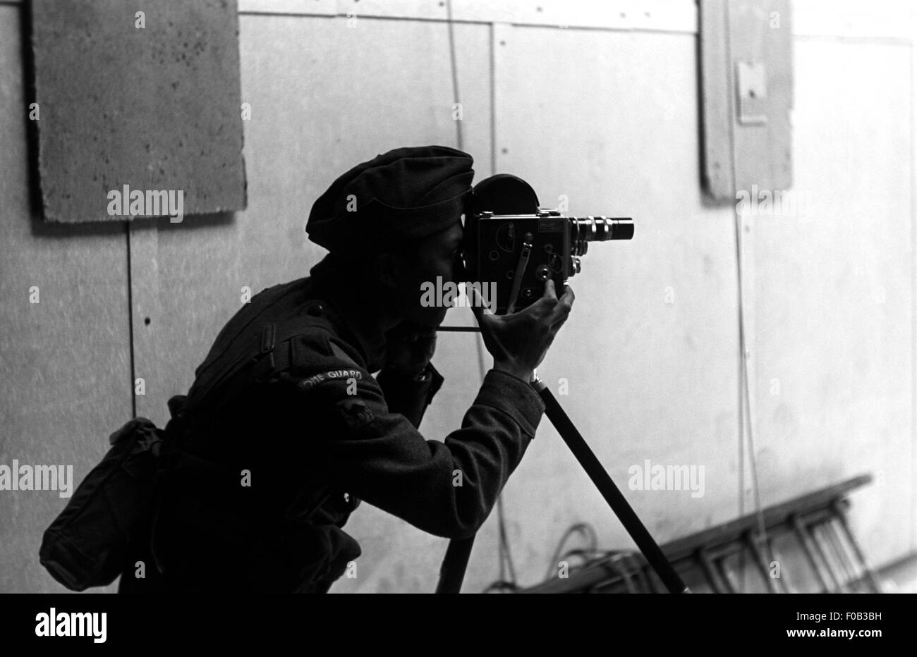 A soldier photographing an interior Stock Photo - Alamy