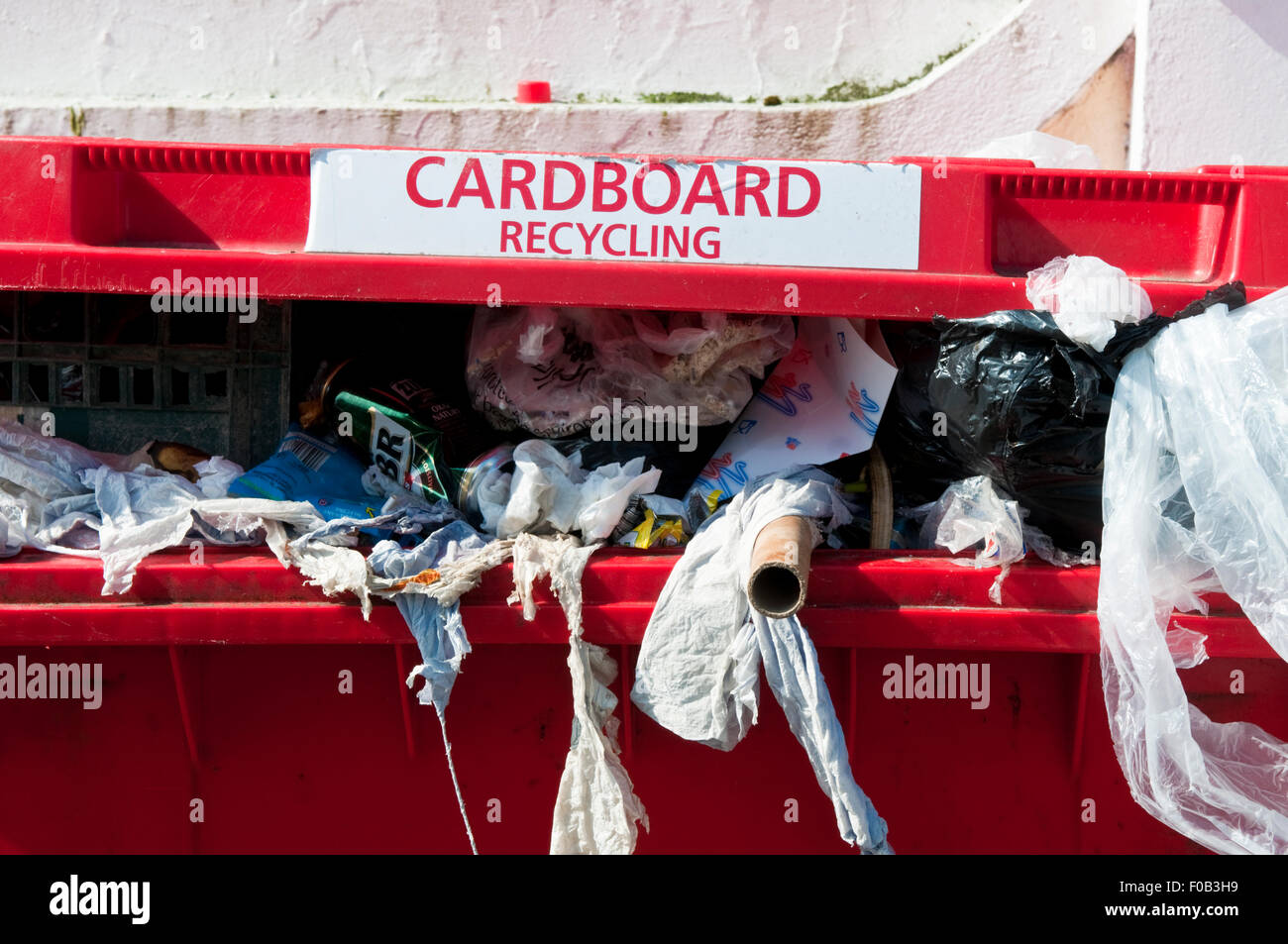 A random collection of rubbish incorrectly dumped in a cardboard only ...