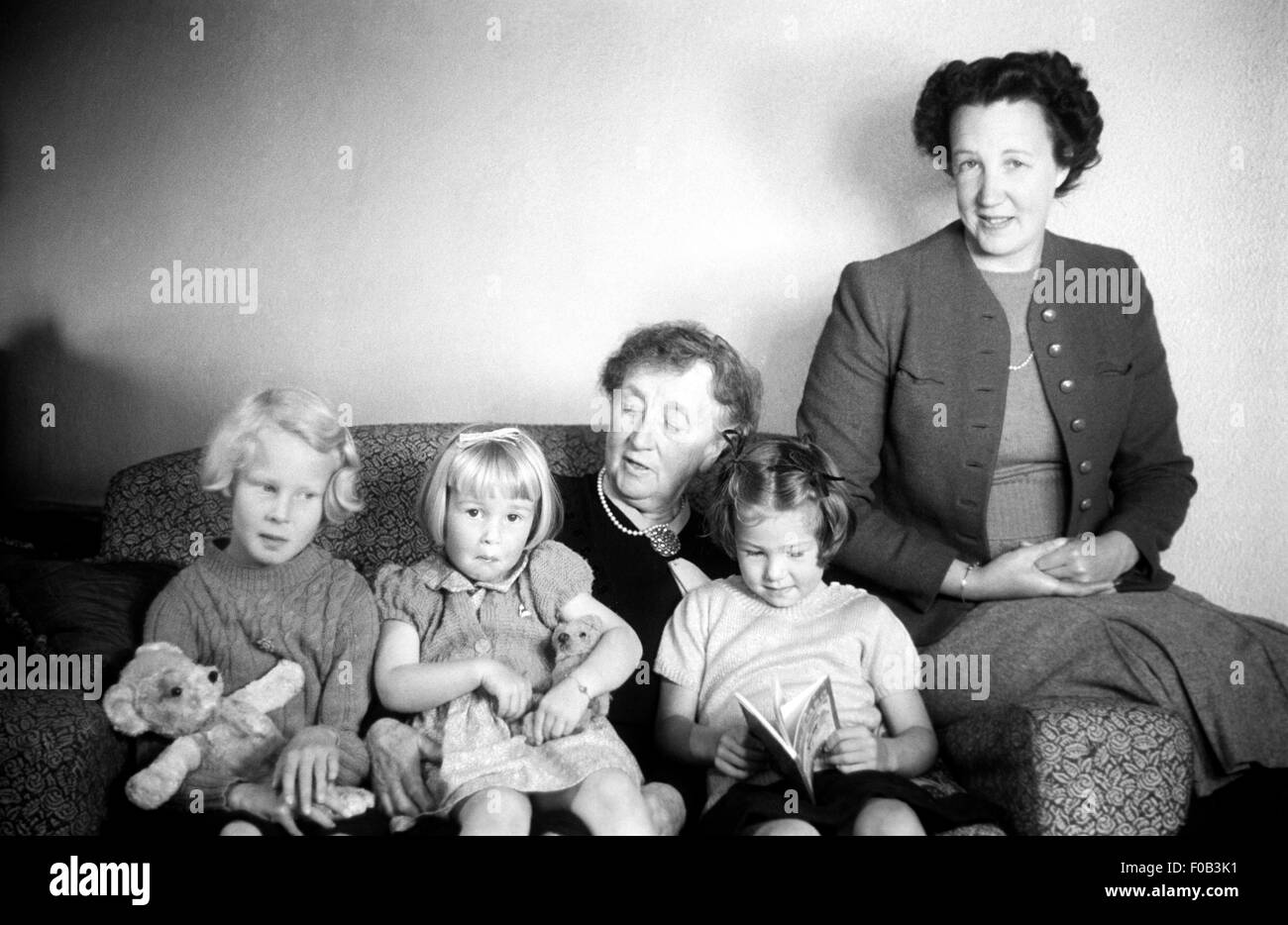 Senior woman holding family Black and White Stock Photos & Images - Alamy