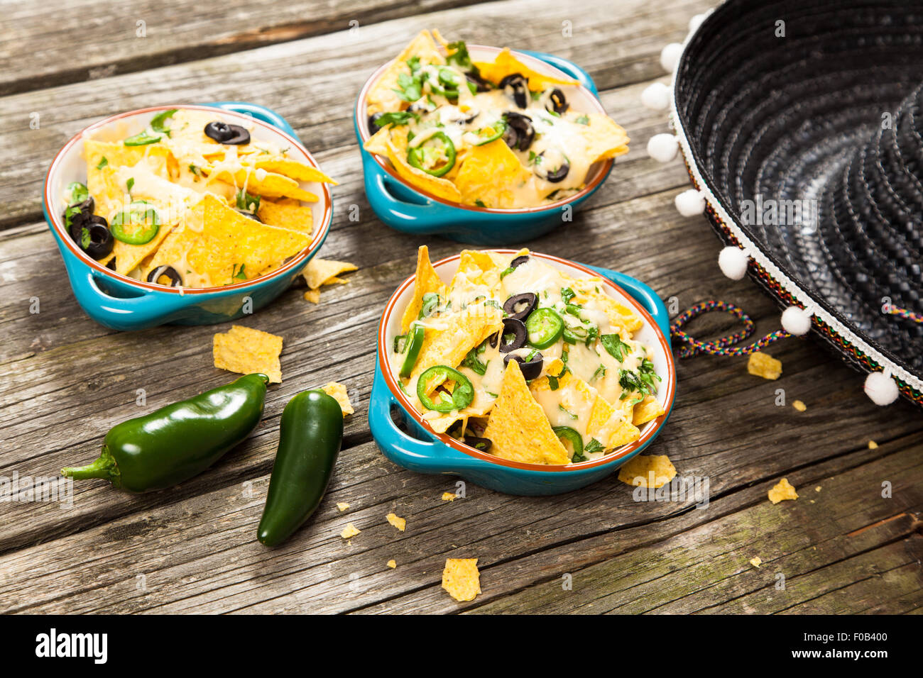 Nachos with melted cheese Stock Photo - Alamy