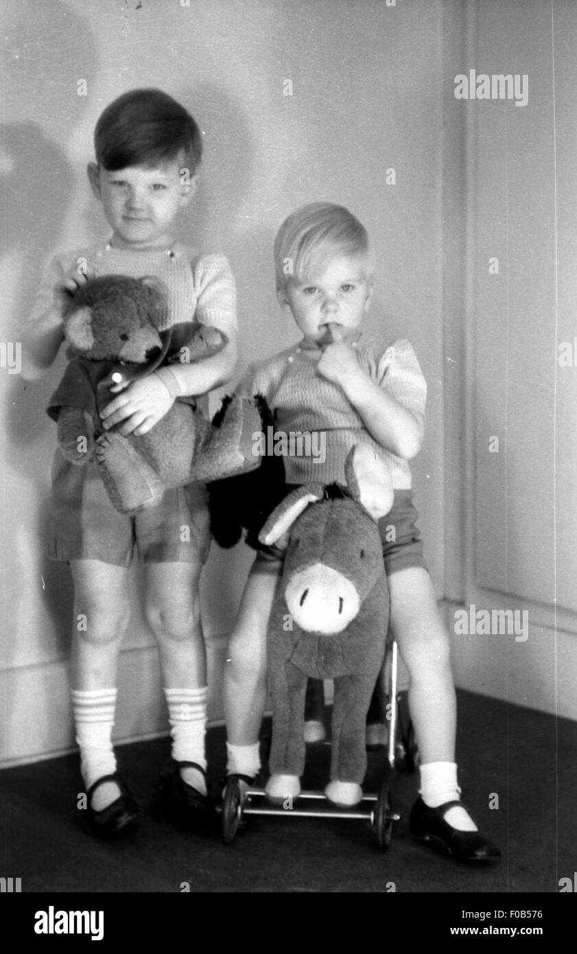 Two boys and their toys Stock Photo - Alamy