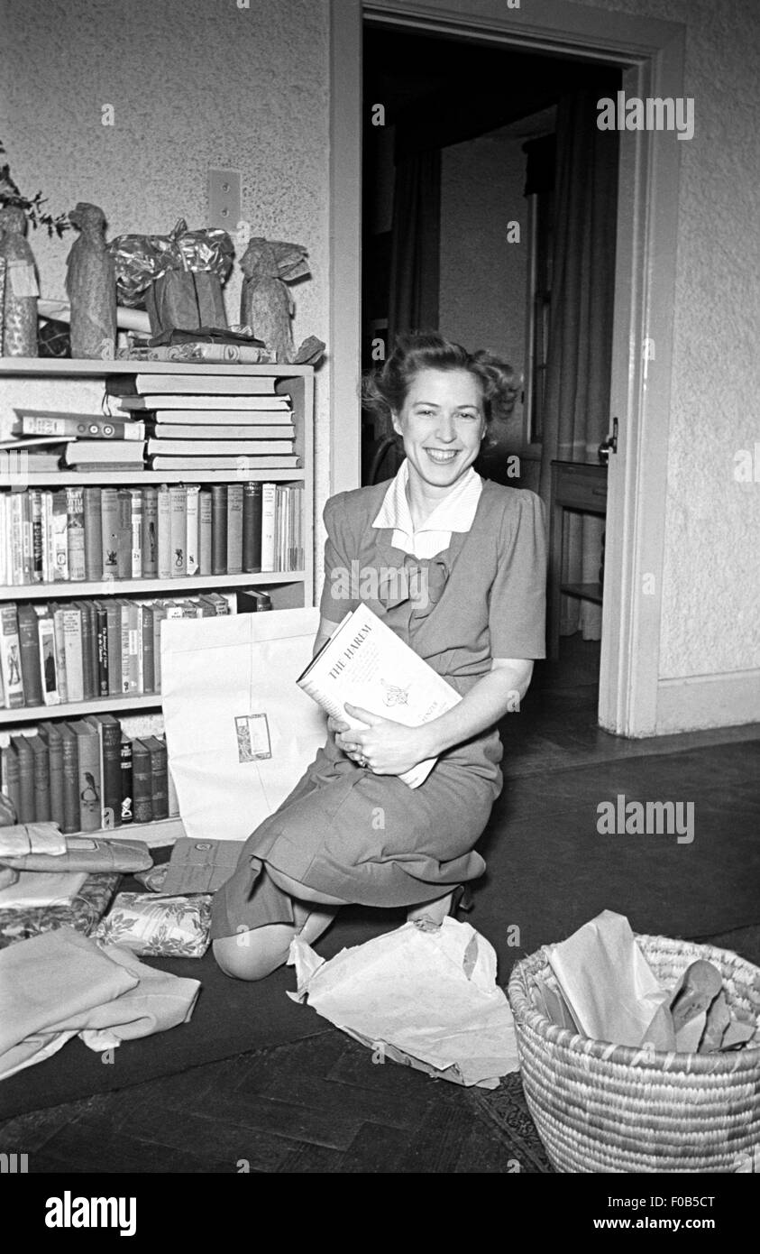 Elizabeth Hunter, Prince Chula's wife, opening parcels in her house ...