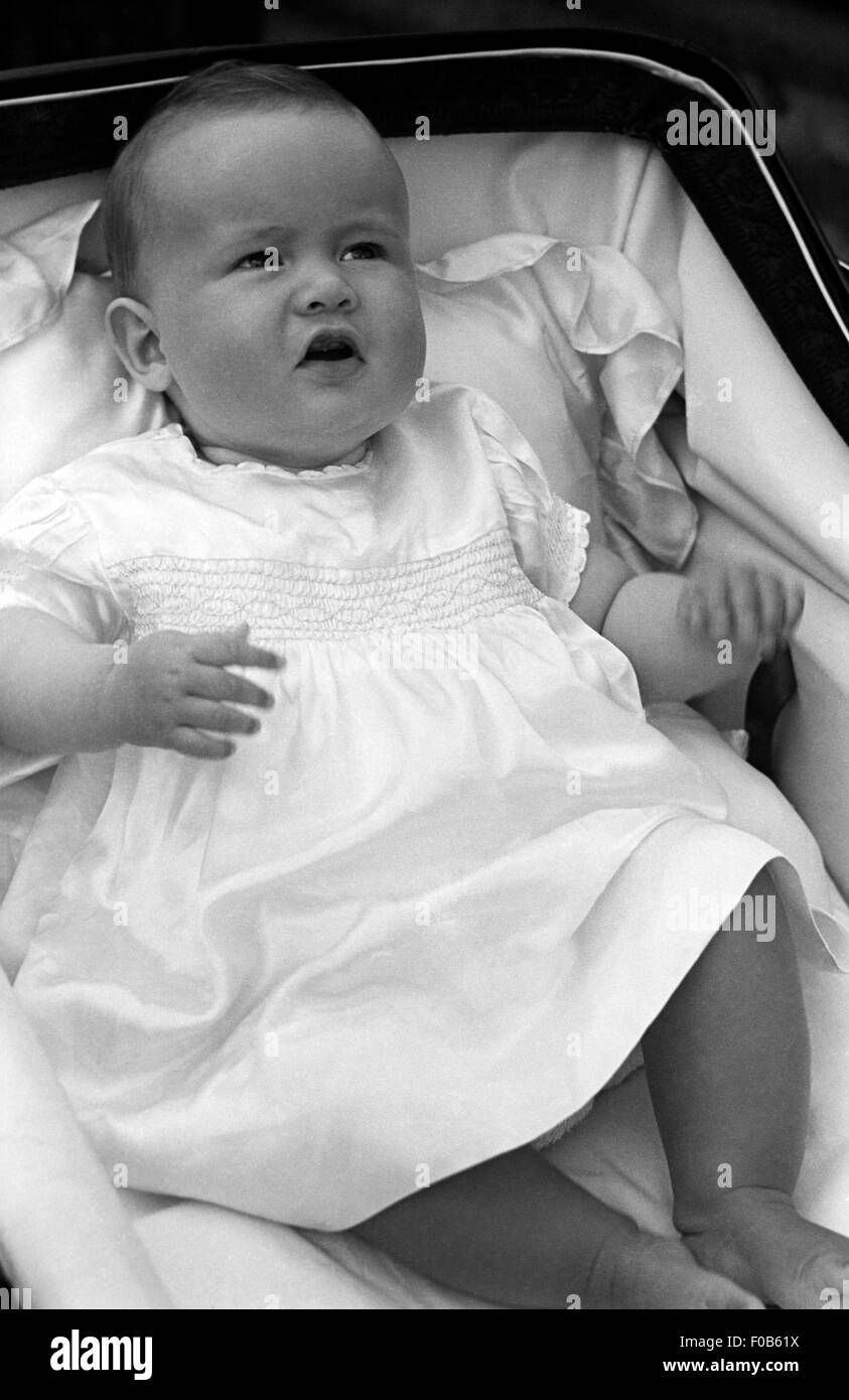 A baby girl lying in a pram Stock Photo - Alamy