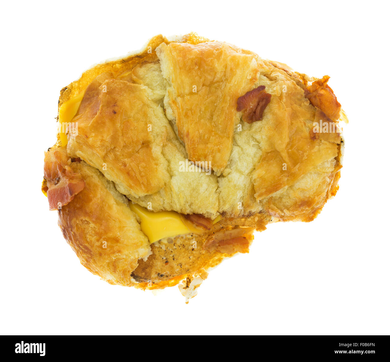 Top view of a bacon egg and cheese croissant breakfast sandwich with a ...