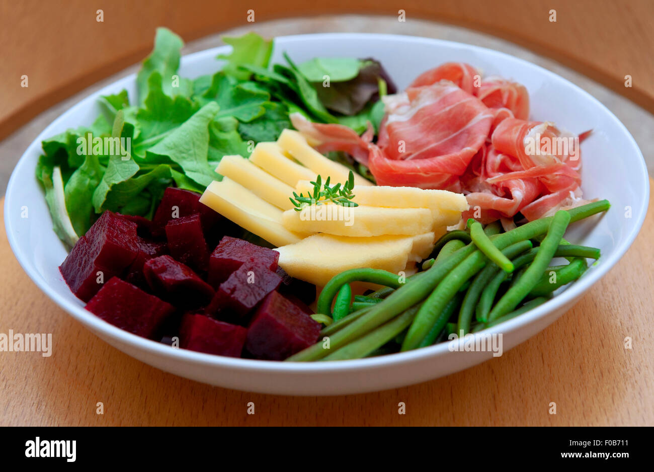 Salad with raw vegetable, ham, cheese and apple Stock Photo - Alamy