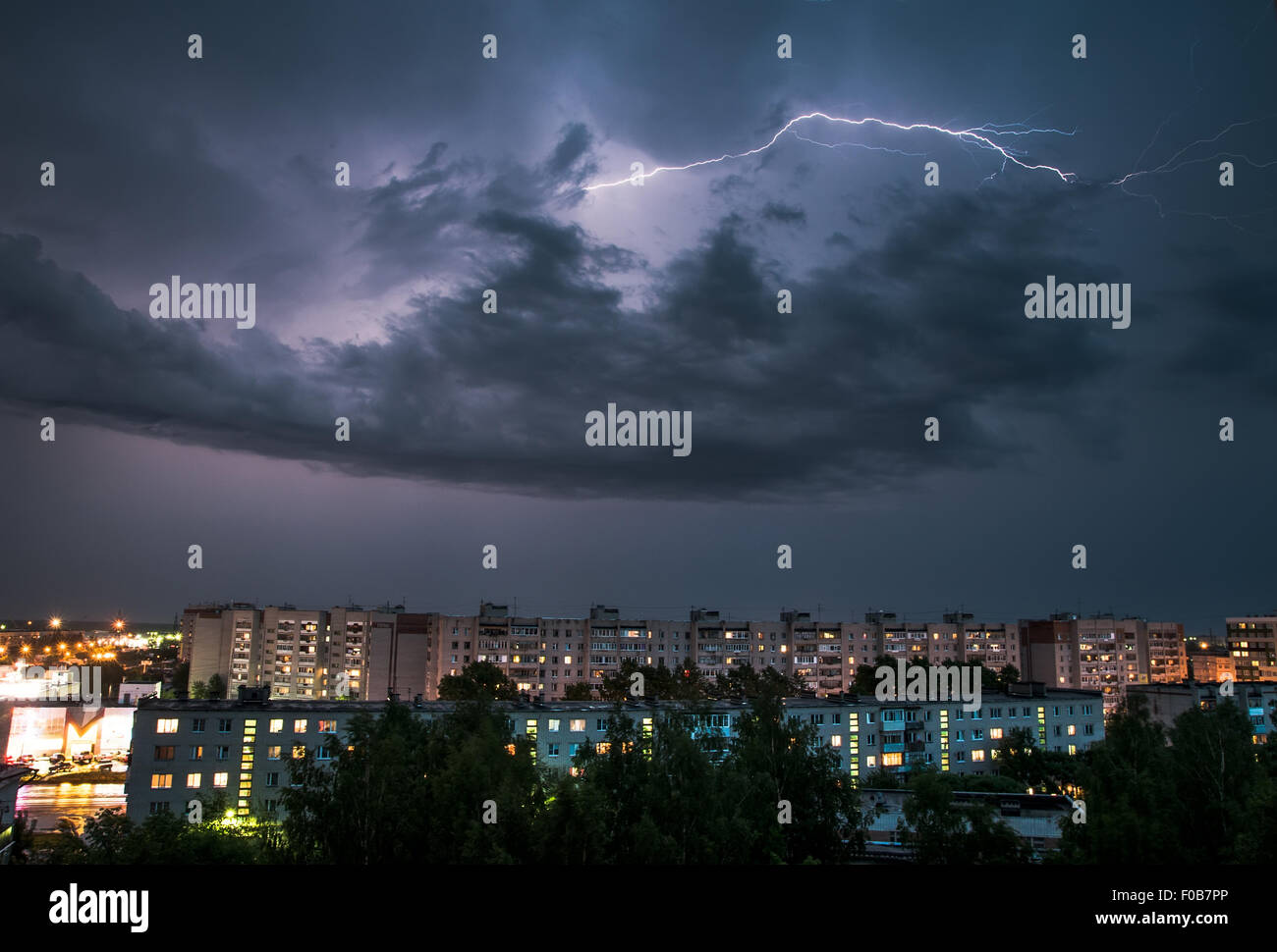 night thunderstorm over the buildings in the city Stock Photo - Alamy
