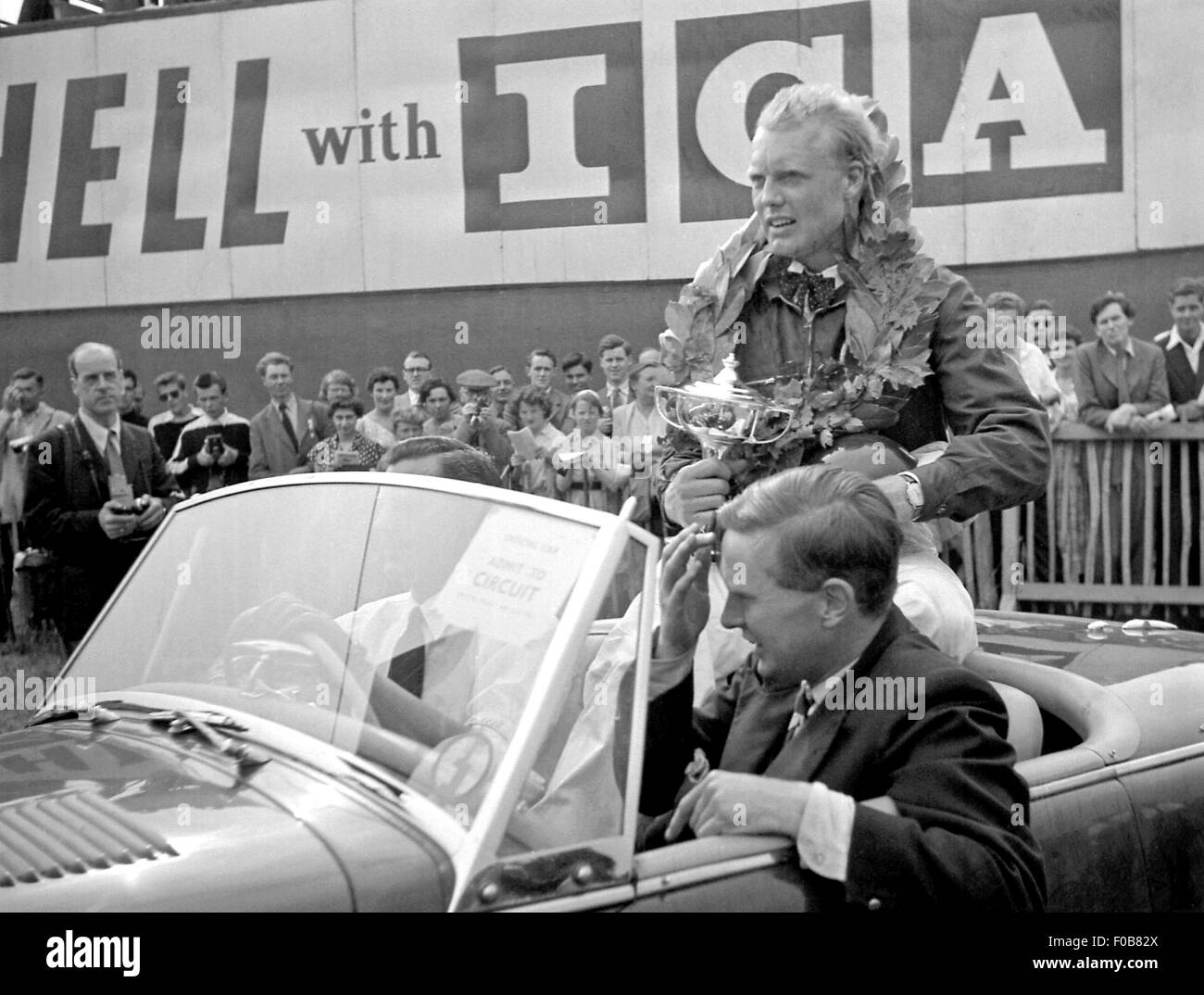 Racing car winner holding up trophy hi-res stock photography and images ...