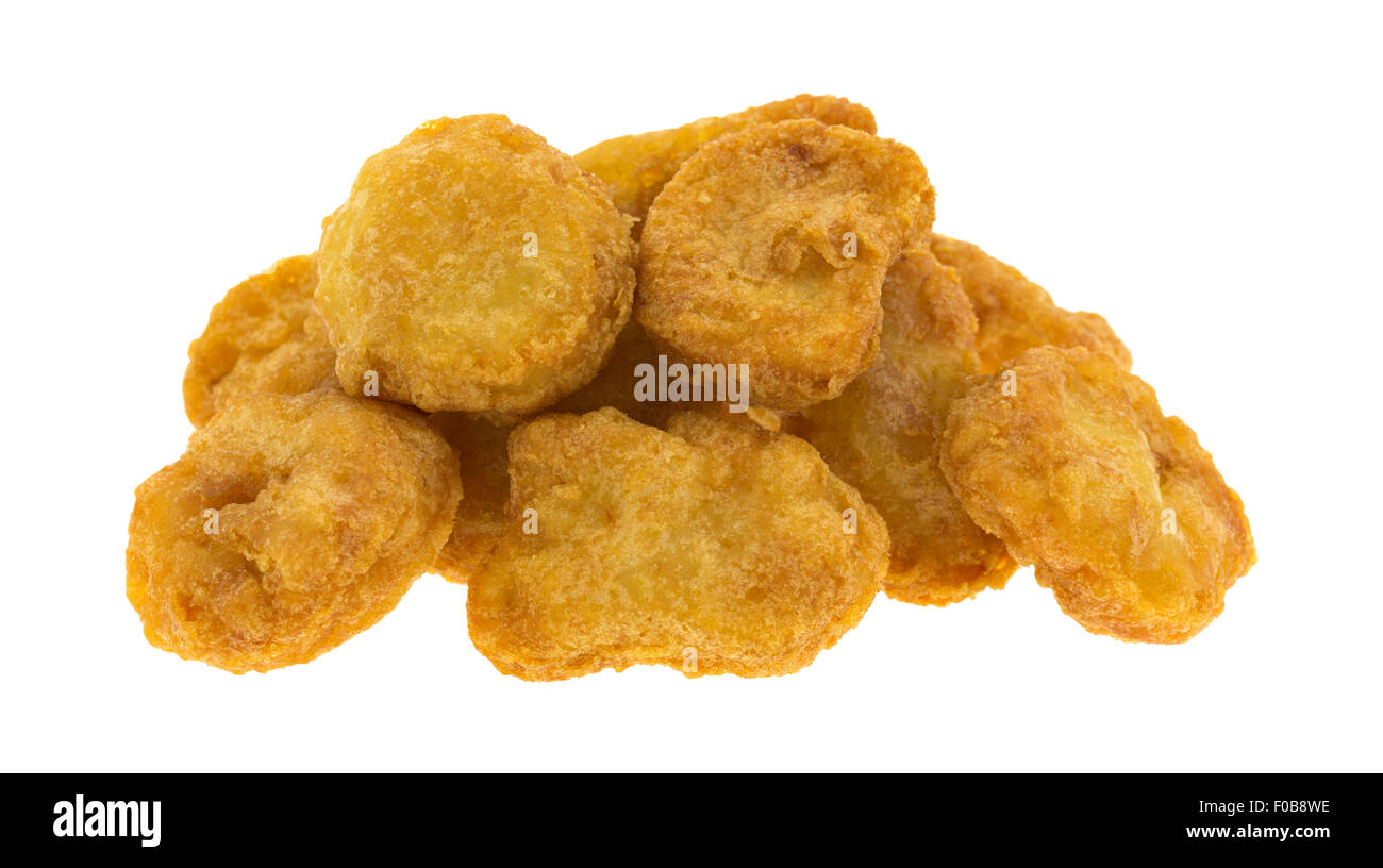 Several chicken nuggets in a small pile isolated on a white background ...
