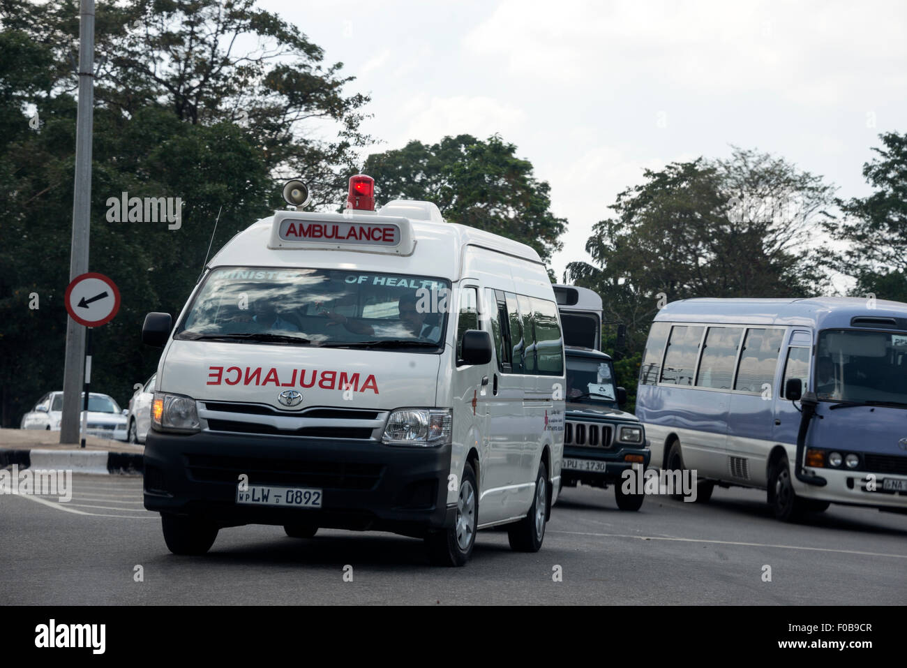 An ambulance on an emergency call weaving through traffic in the streets of Colombo, Sri Lanka ...