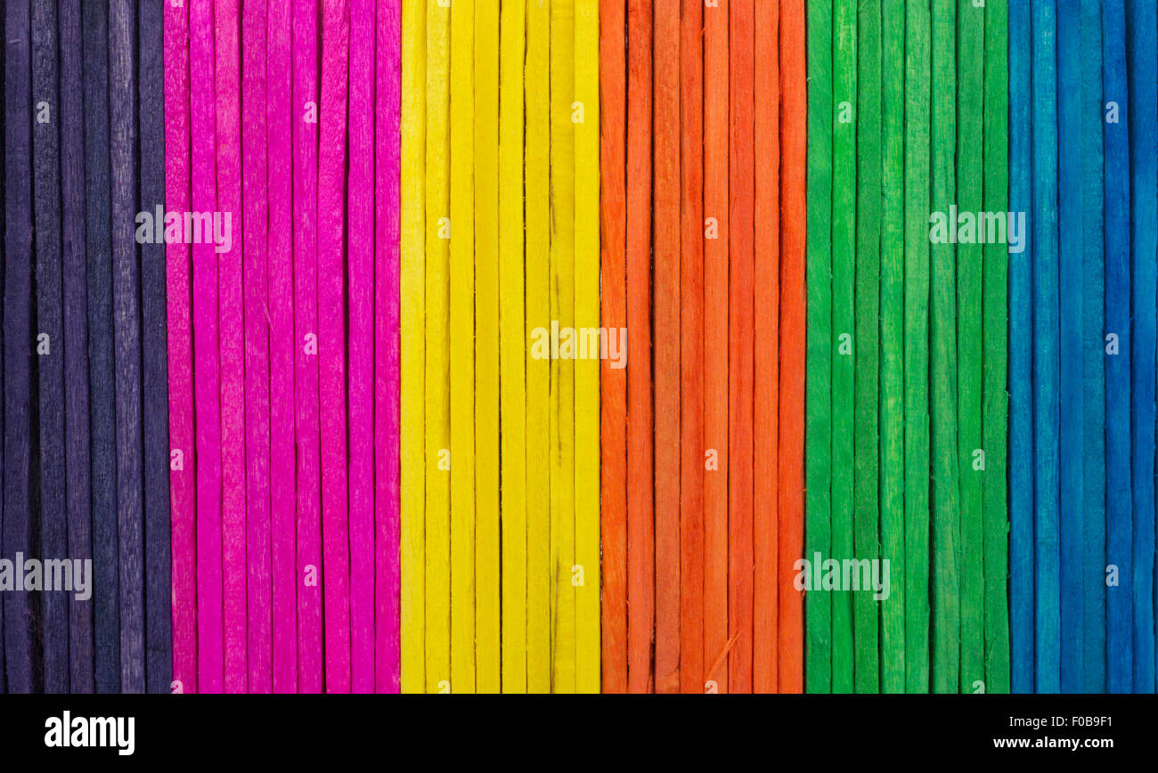 Several rows of colorful new craft sticks Stock Photo - Alamy