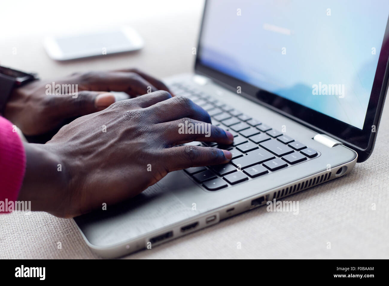 Portrait of handsome young man working with his laptop at home Stock ...