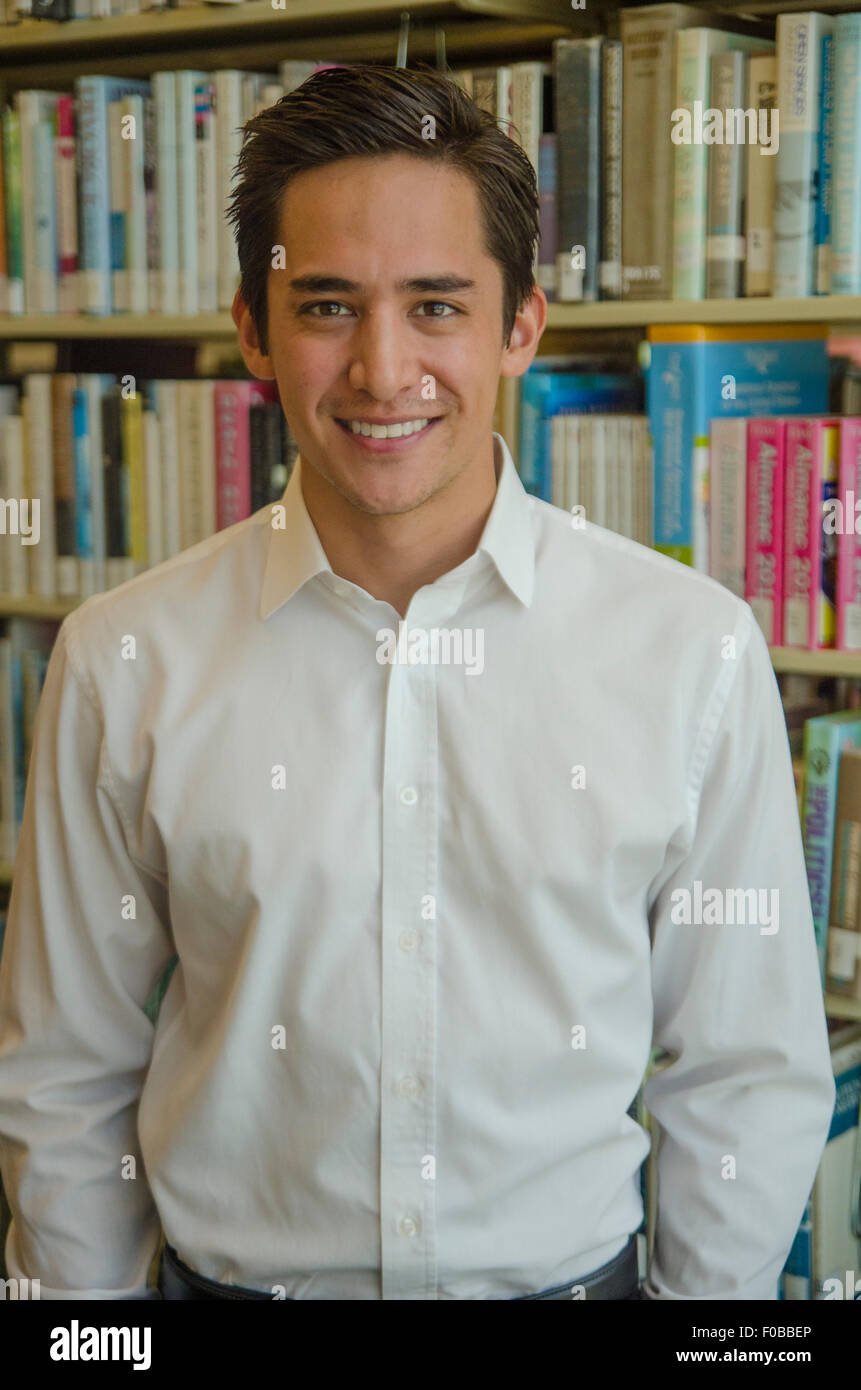 Asian Man in Library wearing suit Stock Photo - Alamy
