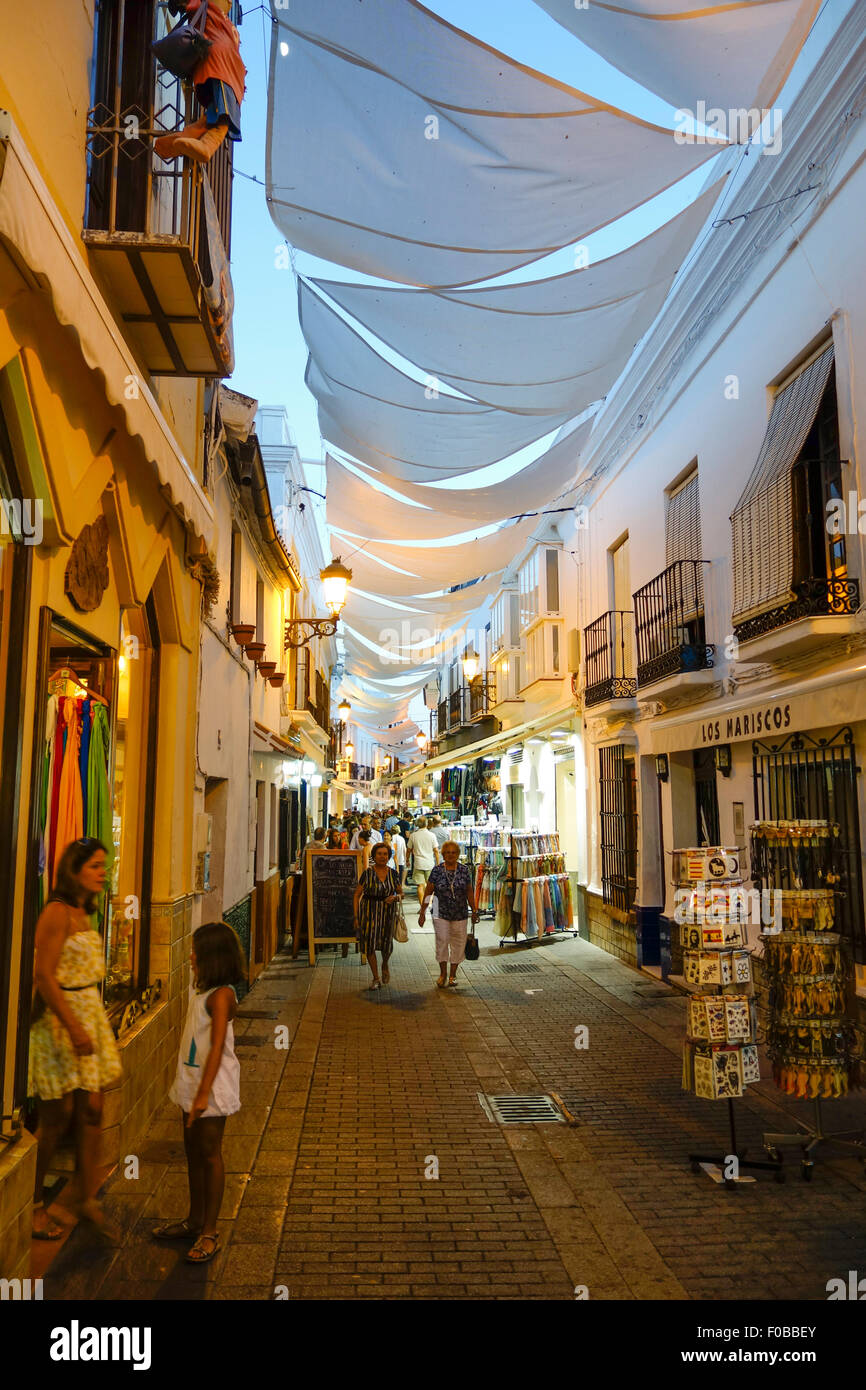 Tourists in Street in Andalusian white village of Nerja covered with ...