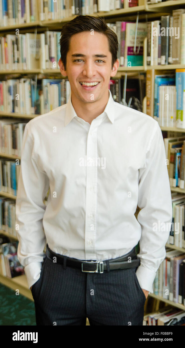 Asian Man in Library wearing suit Stock Photo - Alamy