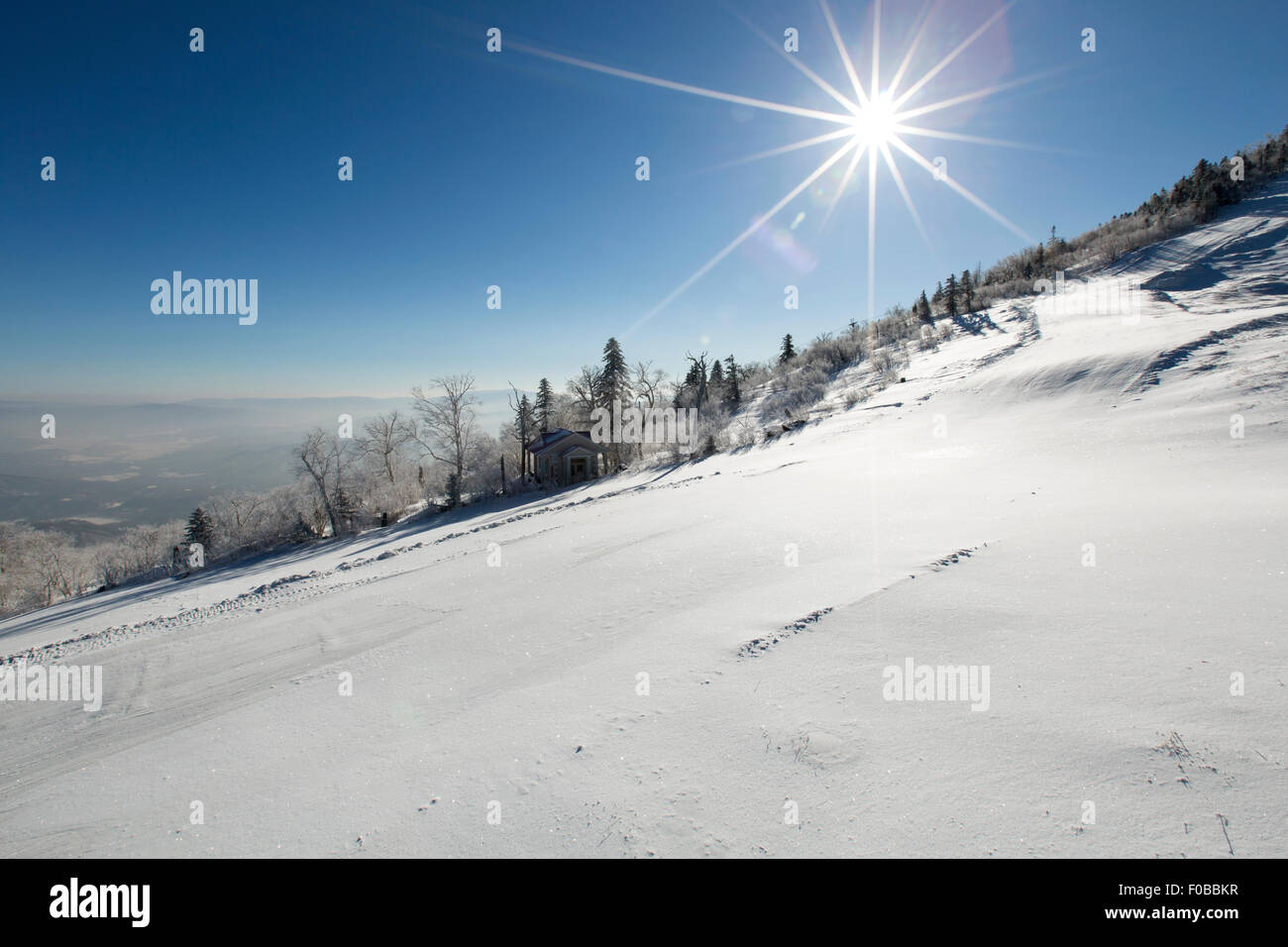 Sun shining on snow, China Stock Photo - Alamy