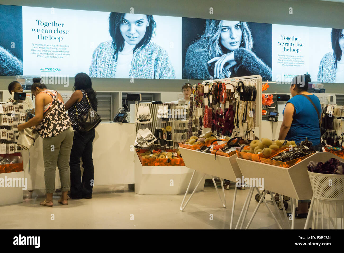 Signage behind the cashiers in an H&M department store in Downtown ...