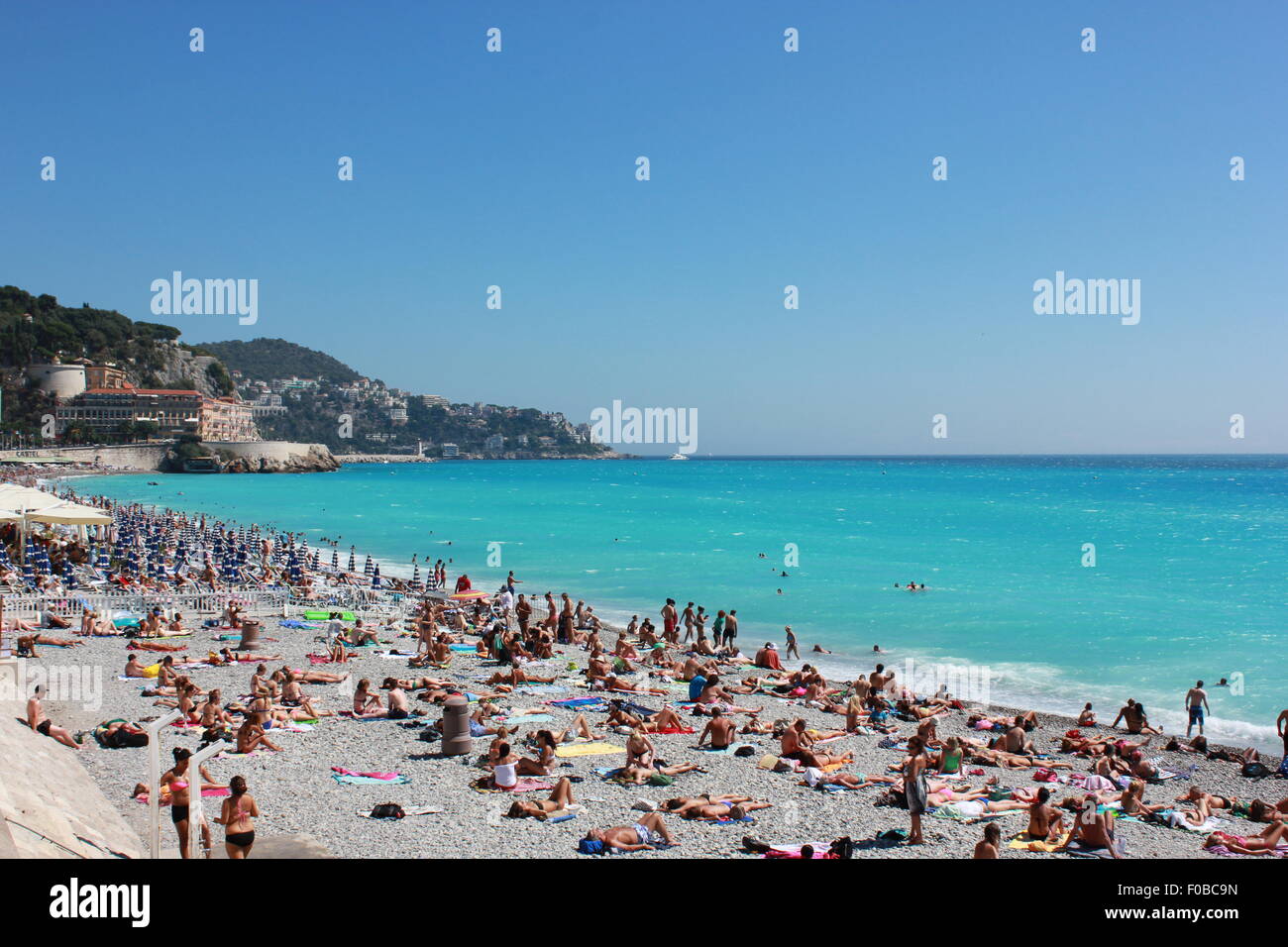 People on beach in NIce during summer Stock Photo - Alamy