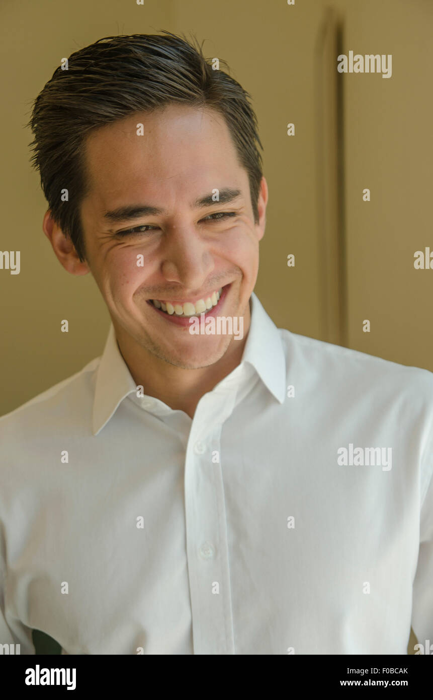 Asian Man in Library wearing suit Stock Photo - Alamy